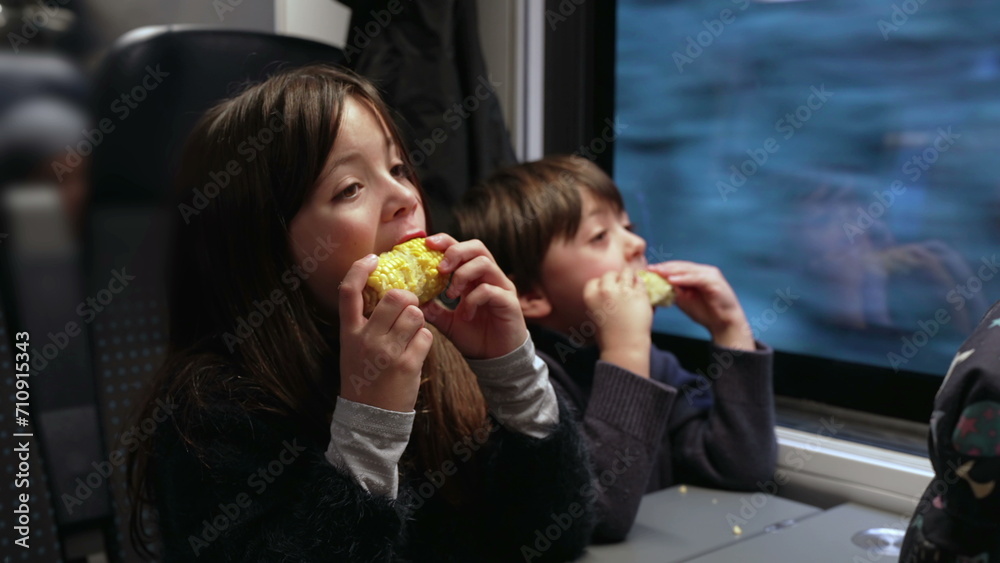 Little Siblings Eating Healthy Corn Snacks During Train Travel Stock ...