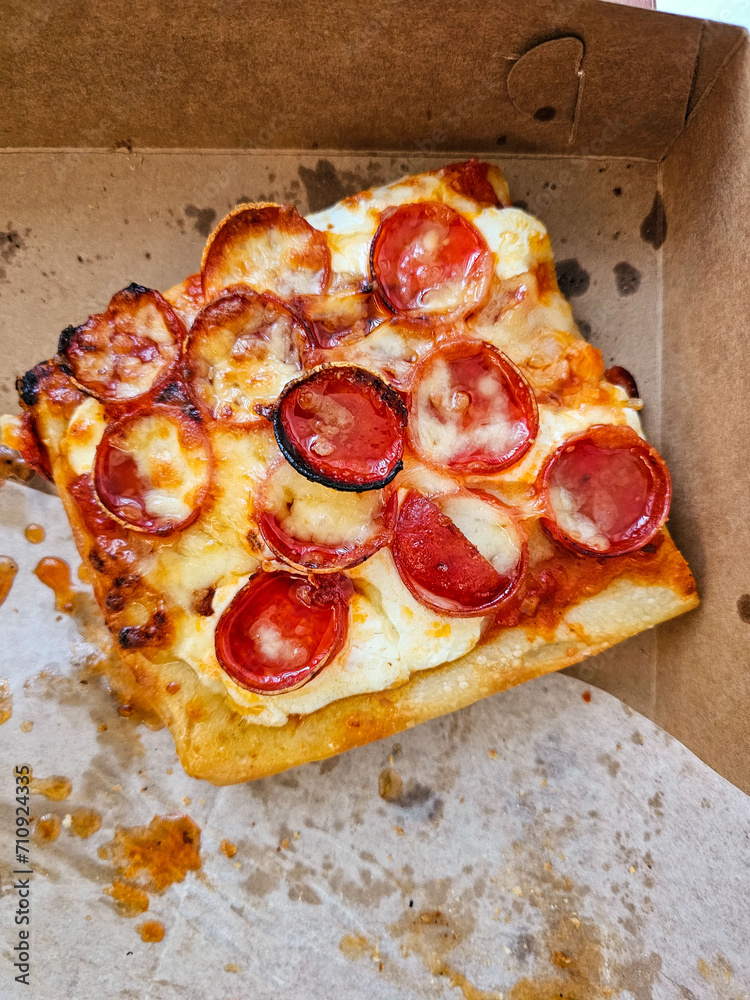 An iconic slice of NY pepperoni pizza, with its tantalizing layers of ...
