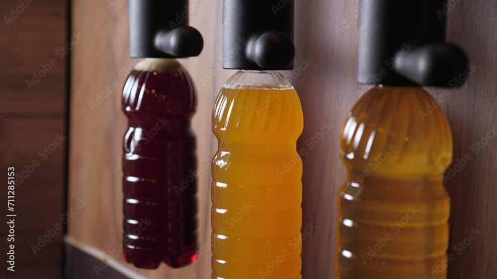 A bar counter with draft beer. Draft beer in plastic bottles. Three ...