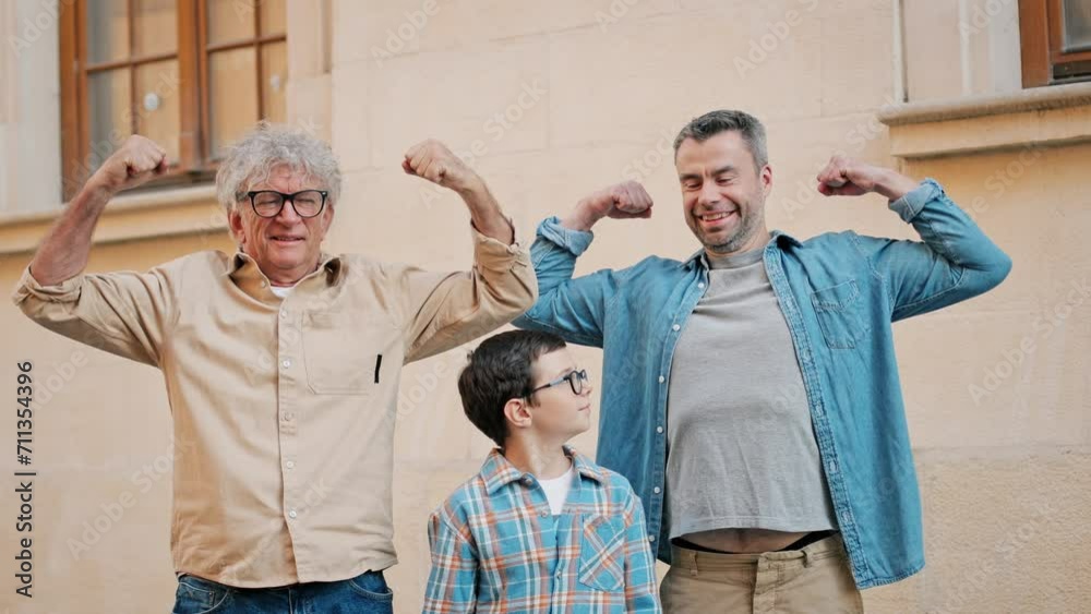 People standing in front of yellow wall and pose to camera how strong ...