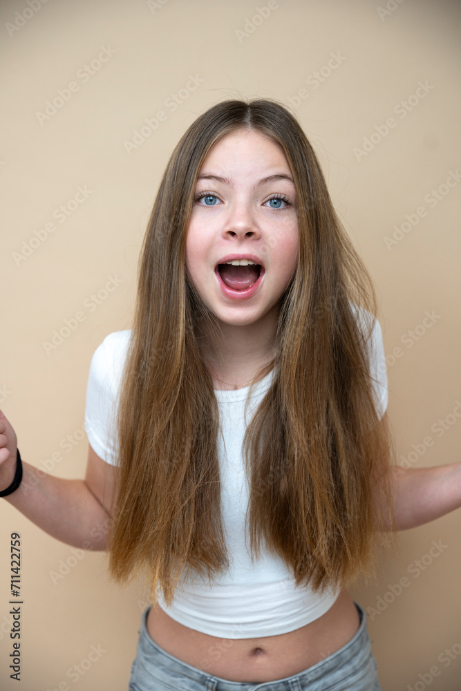 beautiful, cool, cute tween, teenager girl with long hair is posing in ...