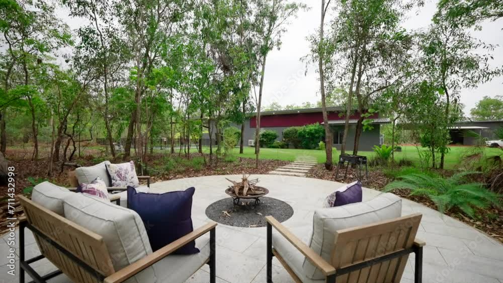 modern styling stone tiled communal fire pit with surrounding chairs ...