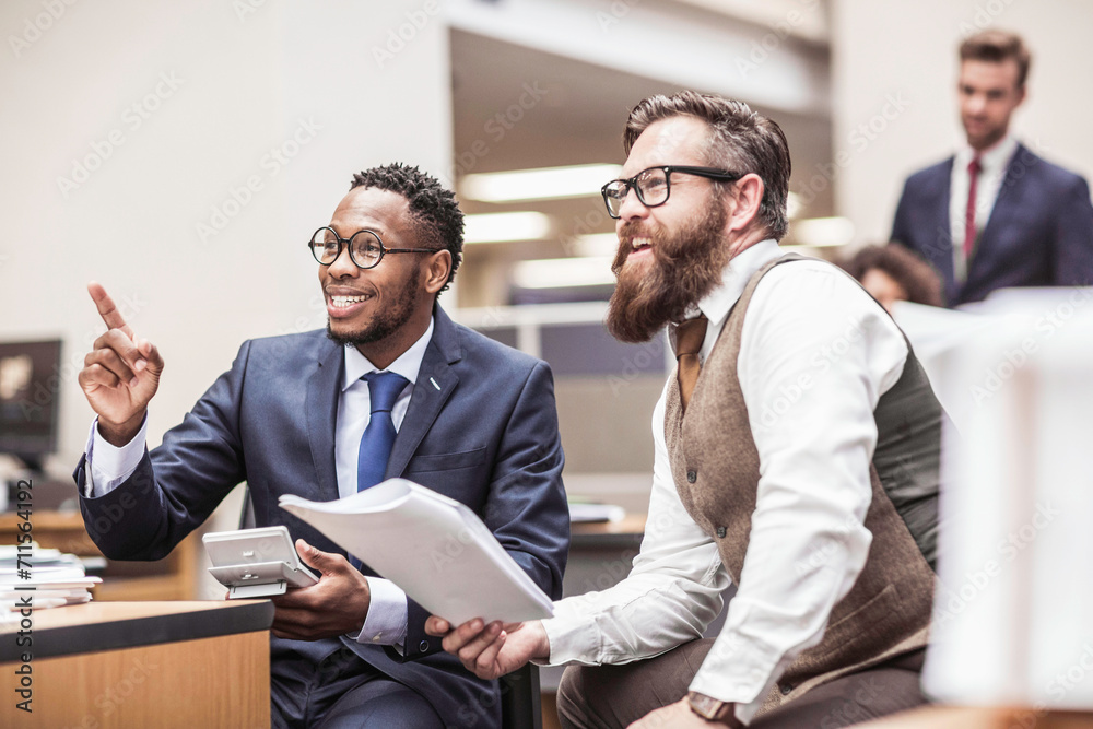 Colleagues with diverse backgrounds working, talking and hanging out in ...