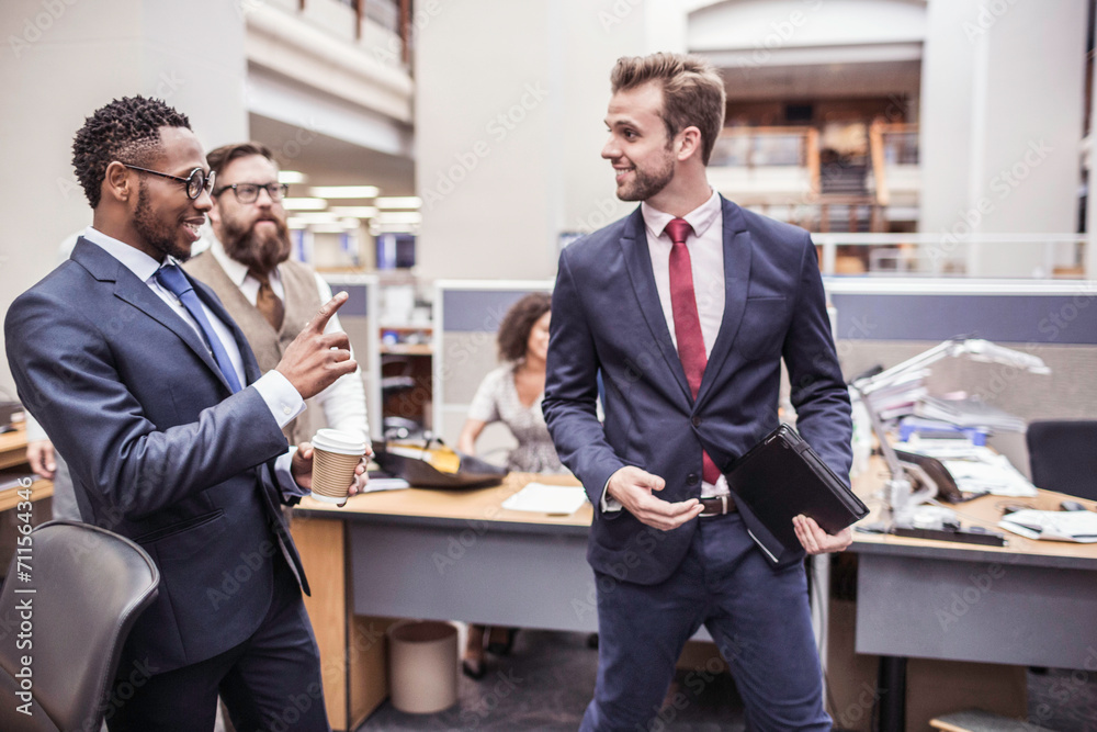 Colleagues with diverse backgrounds working, talking and hanging out in ...