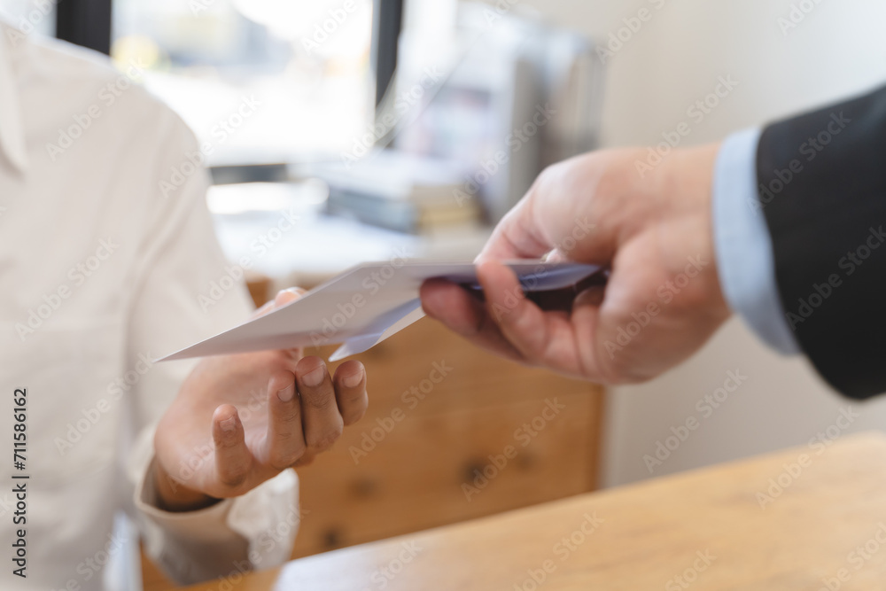 Good job, asian manager man giving financial reward in an envelope ...