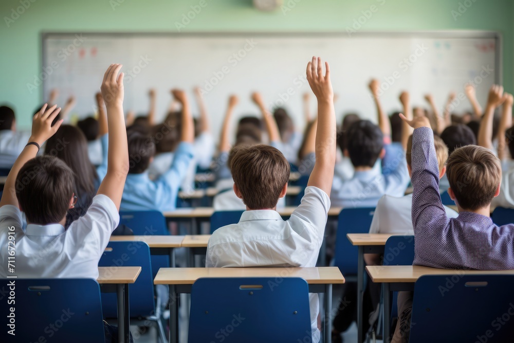 Students sit at their desks in a light white classroom against the ...