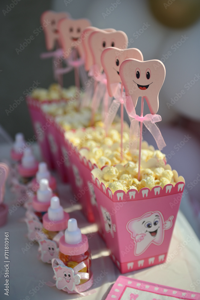 The children's holiday of the first tooth. Small pink boxes with ...