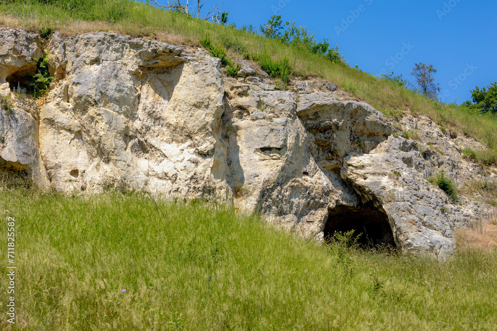 Summer landscape, Rock cliff and hill with grass and trees,The ...