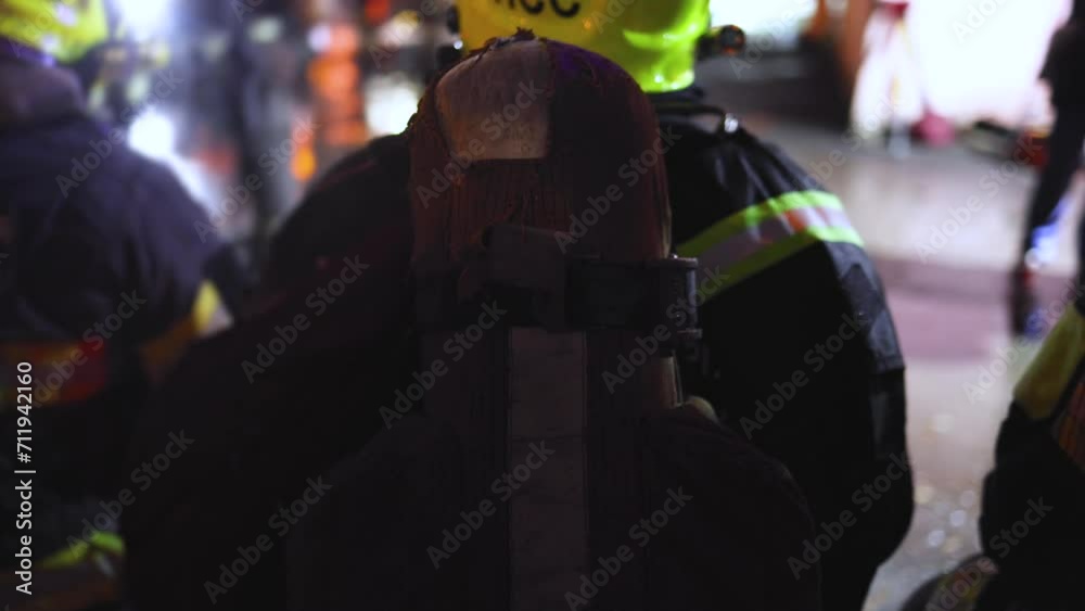 Group of fire men in protective uniform during fire fighting operation ...