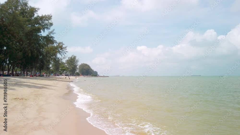 Daytime view of Pantai Puteri Beach in Malacca. Waves from the sea ...