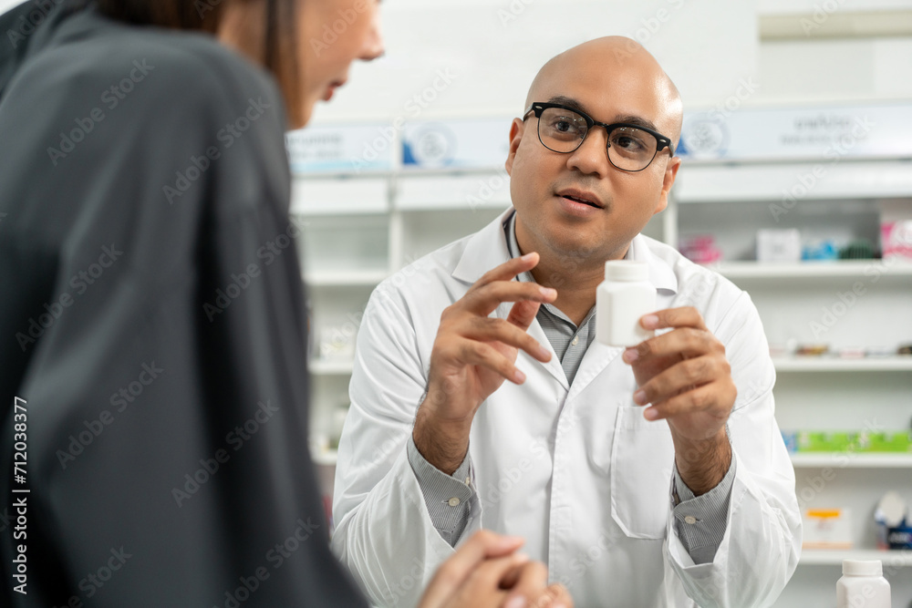 Pharmacist recommends medicines to customers. Asking the questions of ...