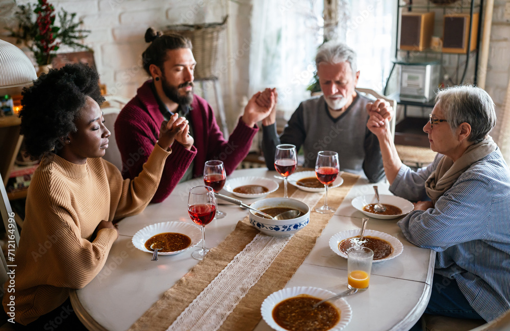Family and religious concept. Group of multiethnic people with food ...
