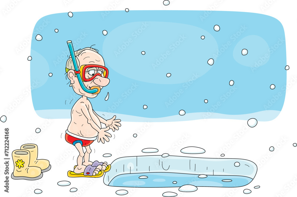 Funny man with a snorkel and a mask going to dive into the ice hole on ...