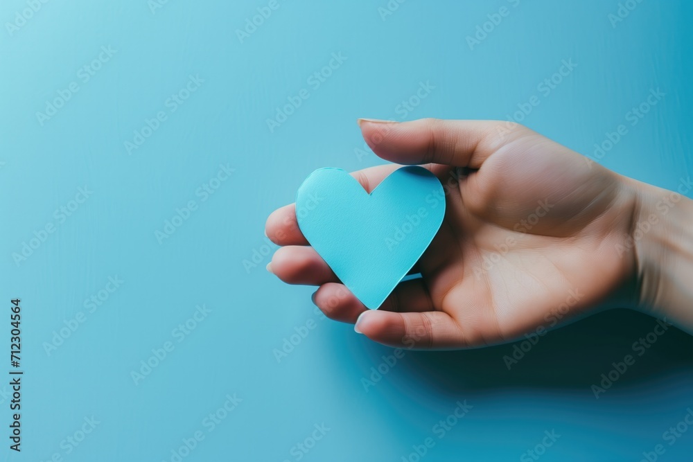 Female Hand Grasps A Blue Paper Heart Expressing Heartfelt Emotions ...