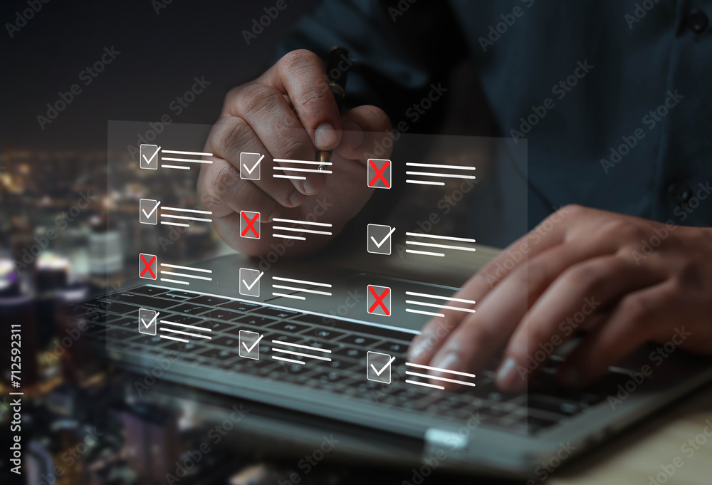 Businessman ticks boxes, summarizes work, keeps score. And checklist of ...