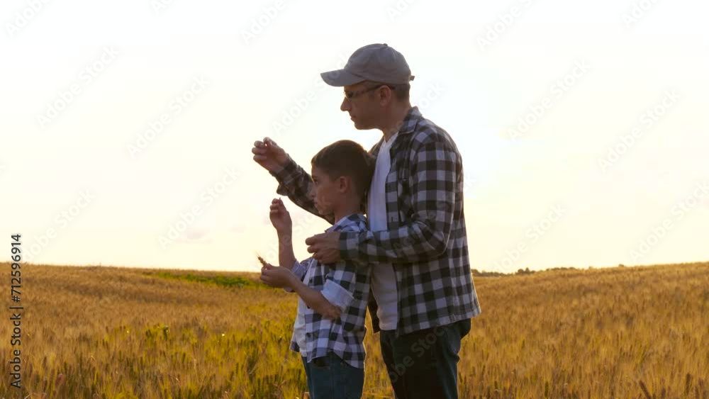 Vidéo Stock Family in nature. Farmers at sunset. Father and son in the ...