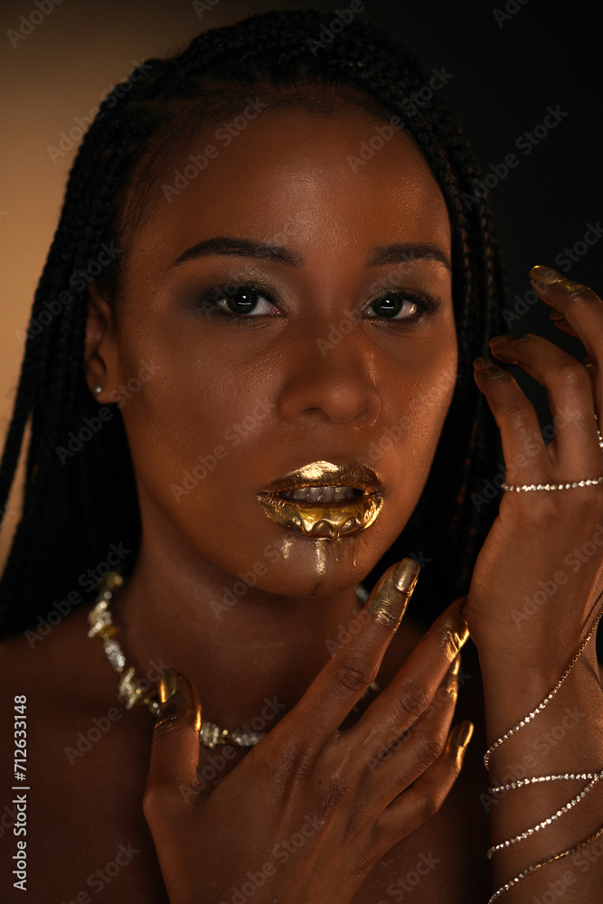 Portrait of a young African American woman with gold chains on her ...