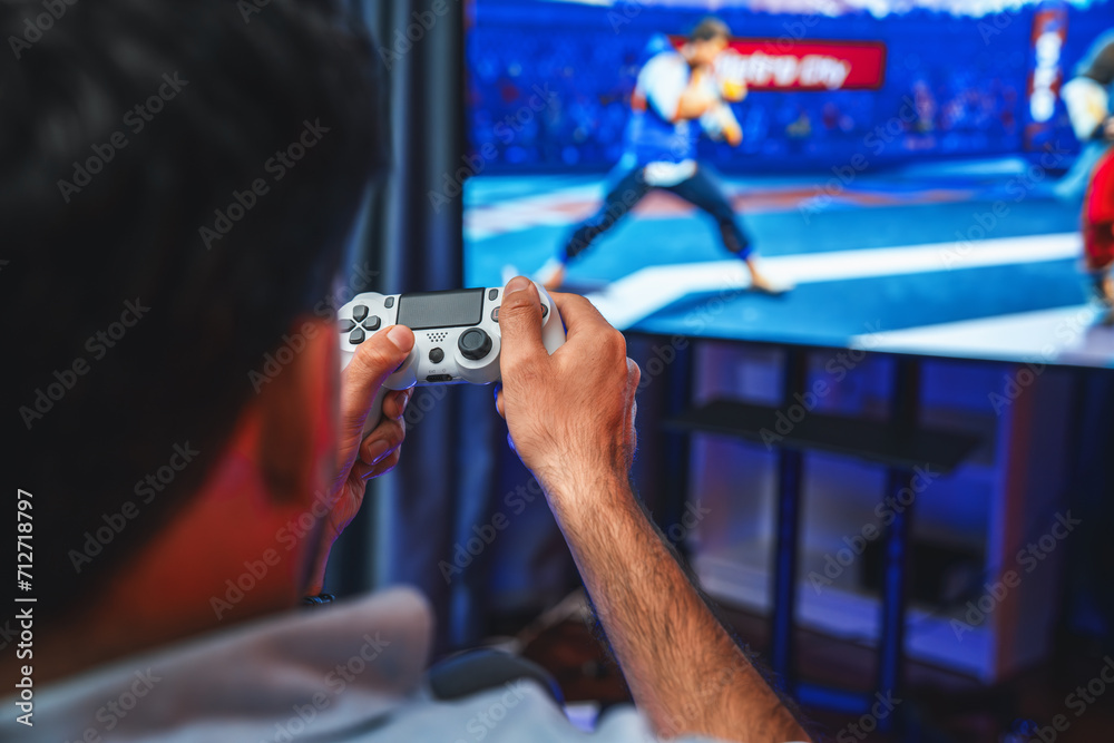 Focusing photo of holding joystick with fighting gaming competition of ...