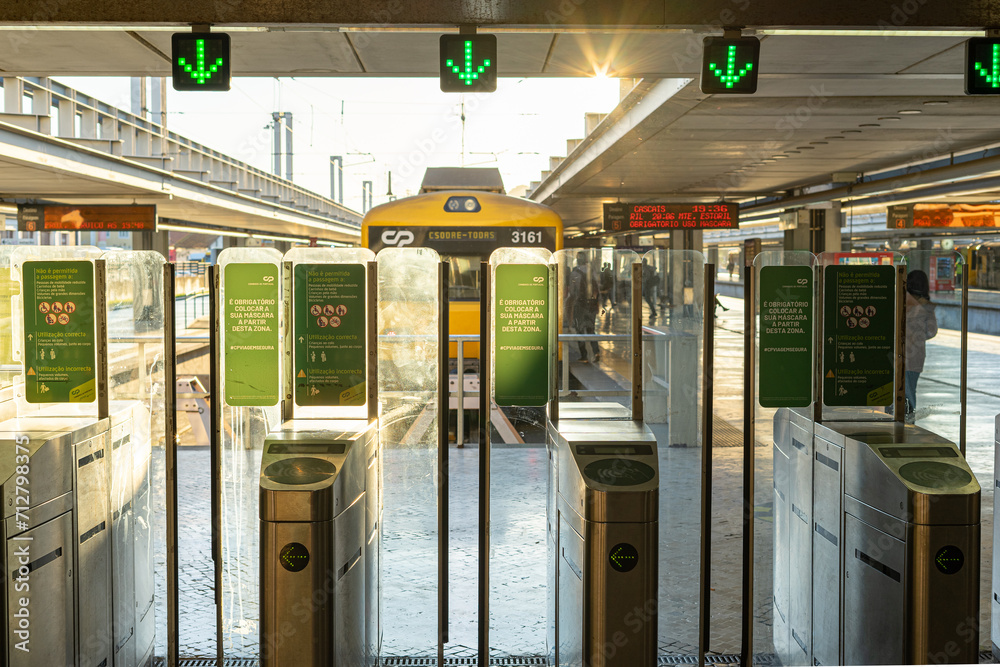 gates, or turnstiles for accessing the train at the railway station ...