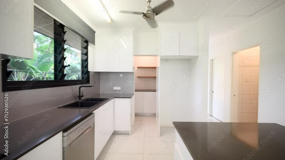 Modern kitchen house home interior with walk in pantry. Black stone ...