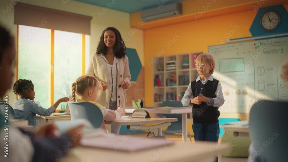 Smart Little Boy Wearing Glasses, Speaking in Front of a Class in a ...