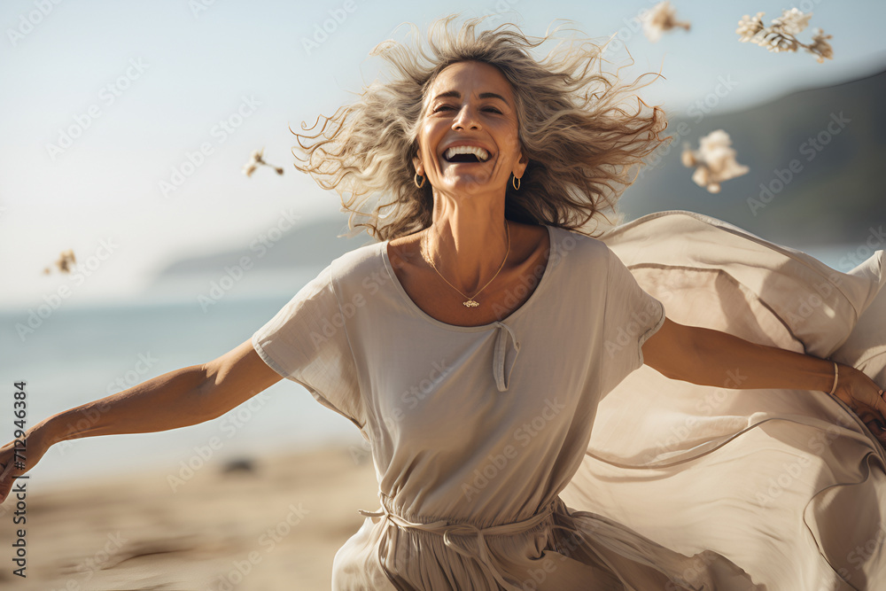 Joyful elderly lifestyle concept. Happy mature woman with arms ...