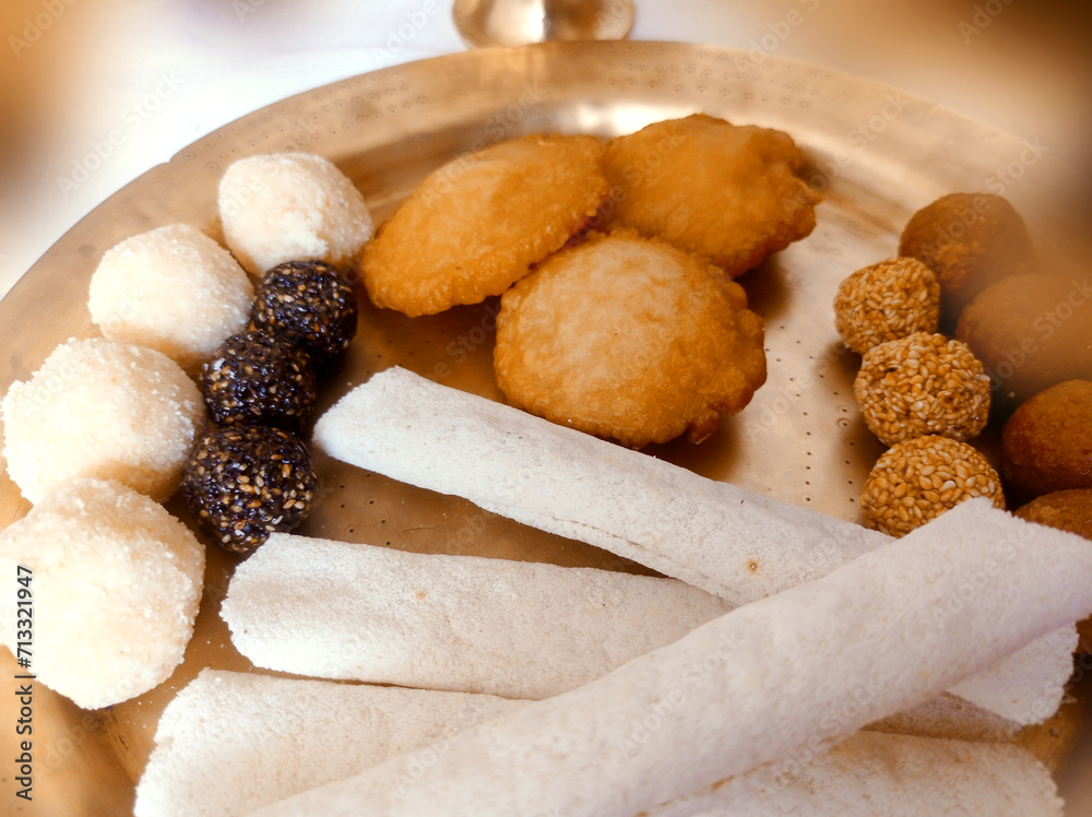 Assamese traditional food items like pitha, laddu, doi sira with ...