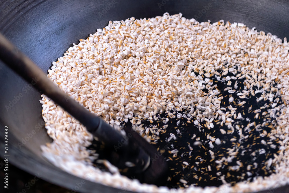 Popcorn rice or pop rice made using black sand instead of oil in ...