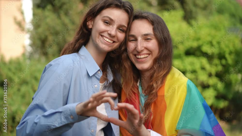 Close-up. The two girls hugged and clasped their fingers in the shape ...