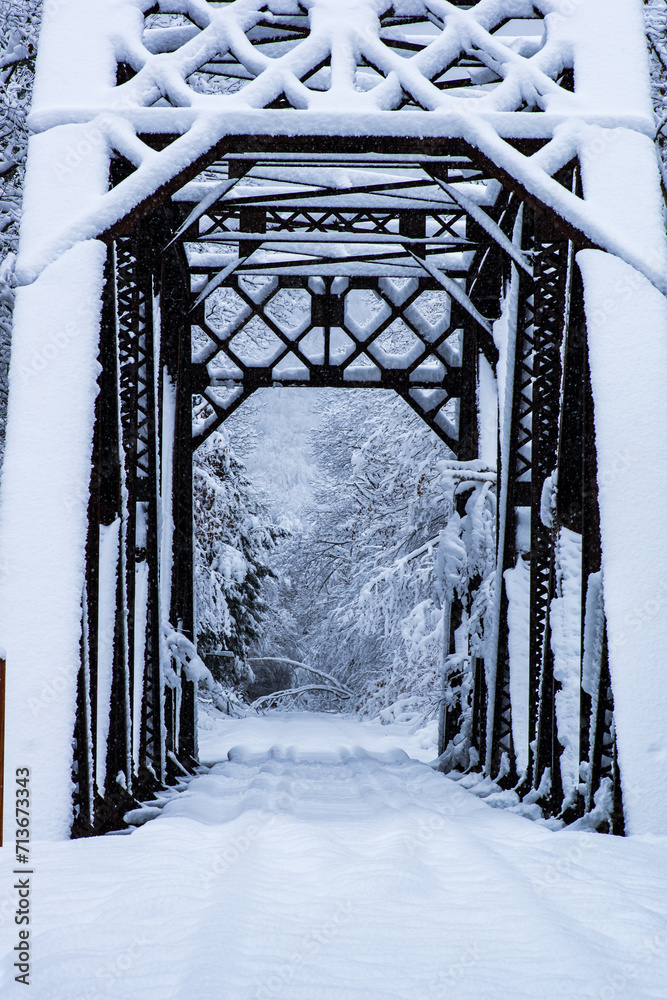 Snow covered railway bridge in winter over the Sawyer River in the ...