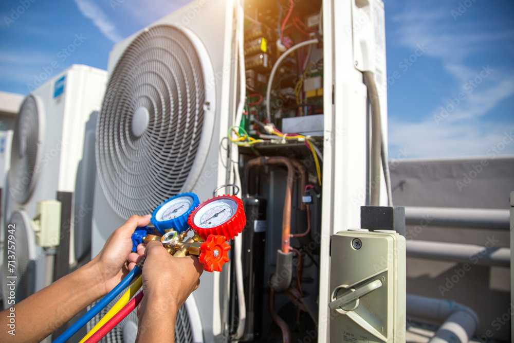 Heat and Air Conditioning, HVAC system service technician using ...
