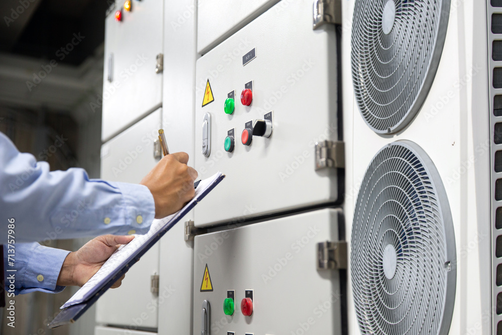 Electrical engineer checking electric at circuit breaker of air ...