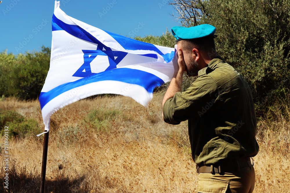 Memorial Day for Israel Fallen Soldiers. IDF fighter mourns near the ...