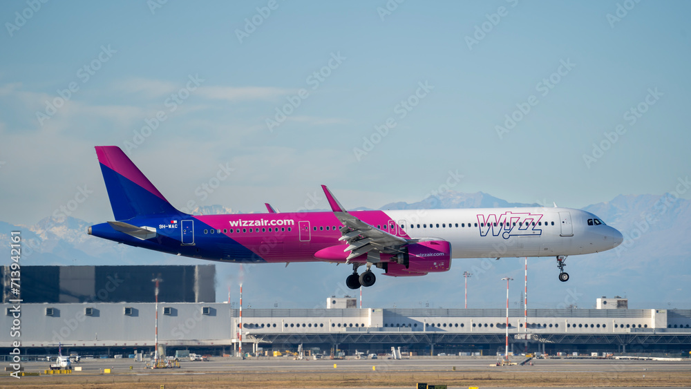 Milano, Italy. Wizzair Airbus A321 is landing at MXP Milano Malpensa international airport Stock ...