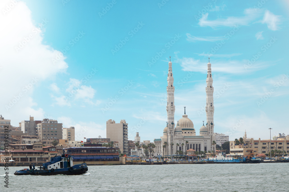 Port Fouad Grand Mosque. suez canal with a grand mosque and blue cloudy ...