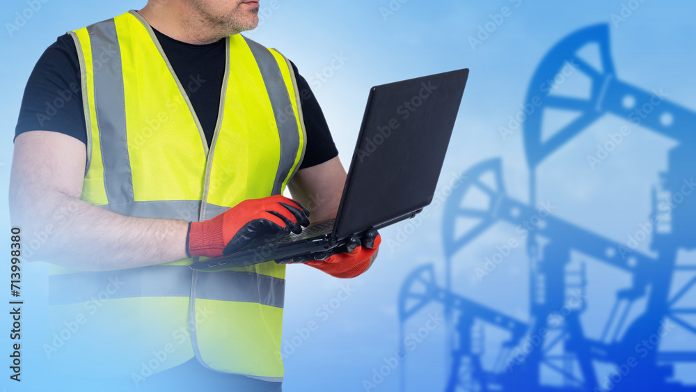 Oil refinery engineer. Worker with laptop in hands. Cropped man near ...