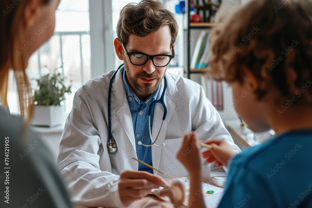 pediatrician demonstrating a simple medical procedure using child ...