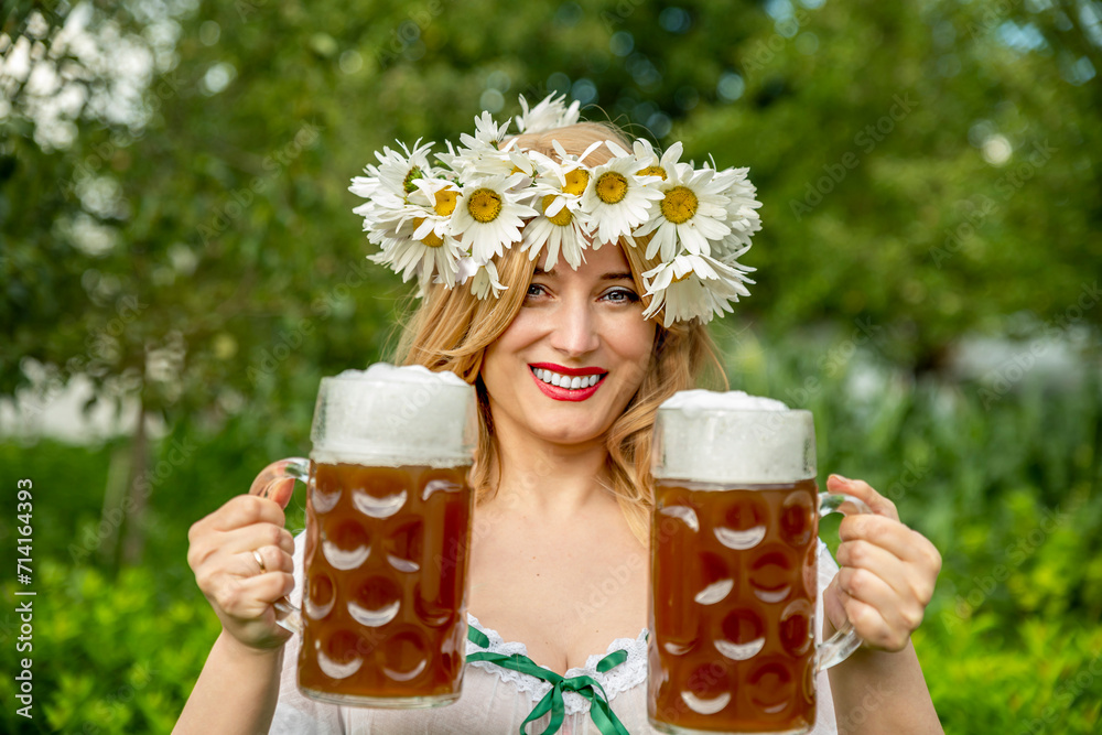 Midsummer woman waitress serving big beer mugs during beer party. Wheat ...