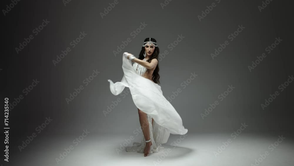 A woman dances in an oriental dance costume. Sensuality in belly ...