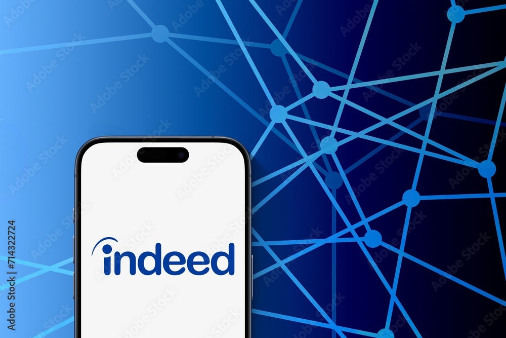indeed logo is displayed on a modern smartphone, blue connected dots ...