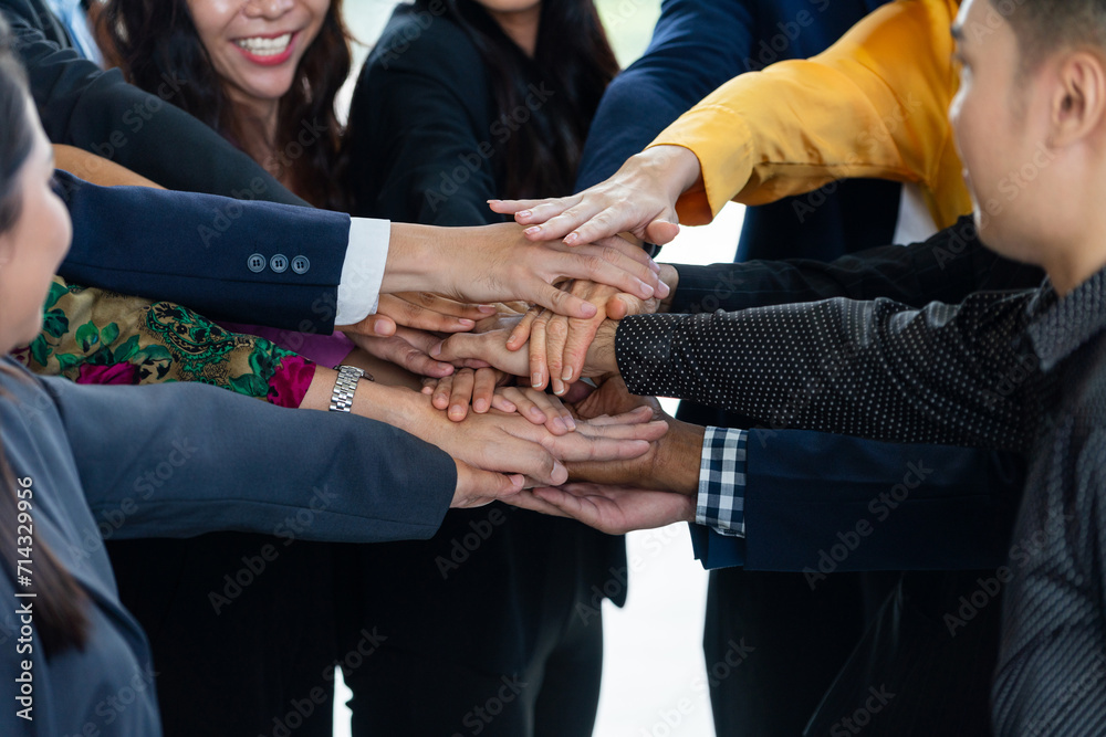 A group of diversity people putting their hands together. Showing unity ...