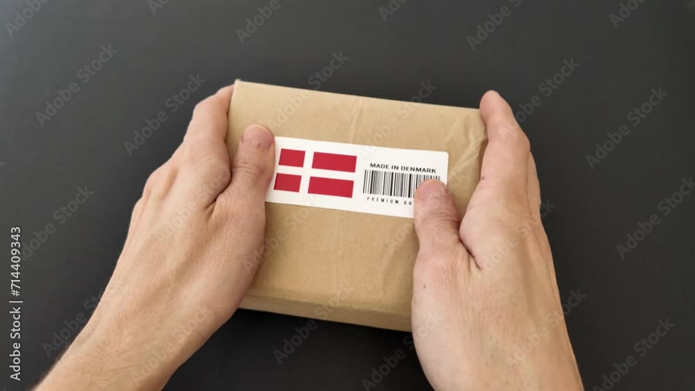 Labeling cargo package with the description Made in Denmark, Premium ...