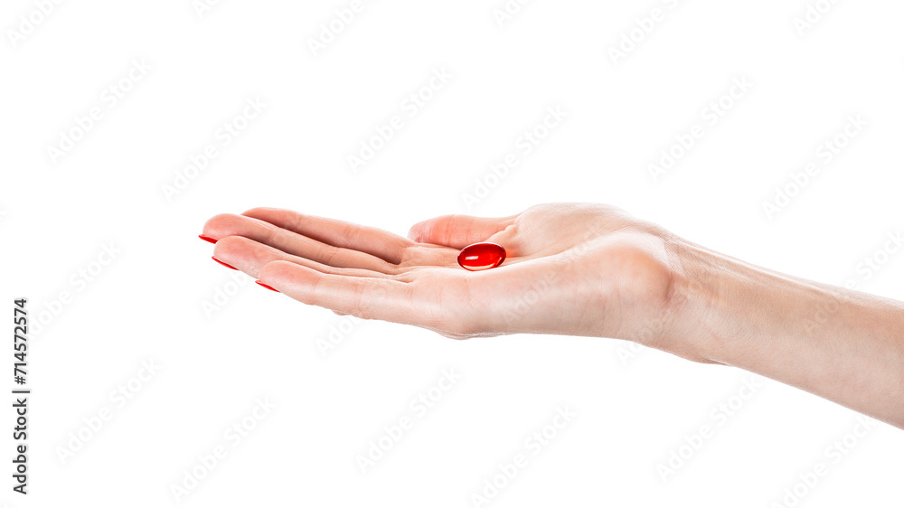Hand holding a red capsule isolated on white background. Red pill ...