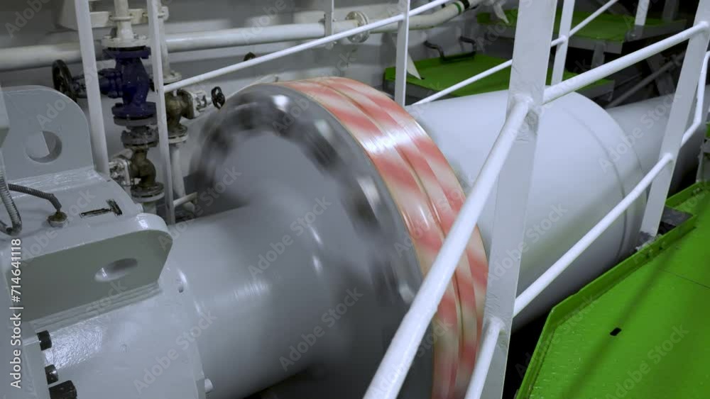 Main shaft rotates in motor room of vessel. Shaft from engine to ...