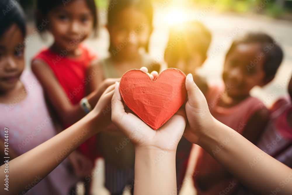 child holding a small pink heart. symbol of love, family, hope ...