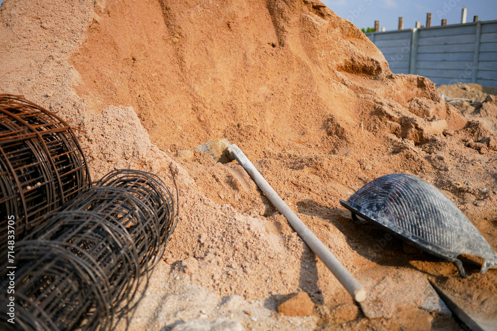 Black plastic clam-shell shaped basket used for transporting soil in ...