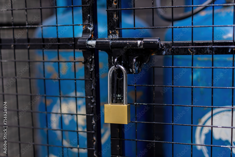 Padlock on closed doors. Door with lock. Lock on an old gate. Lock on a ...