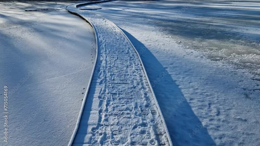 floating walkway made of wooden planks. narrow curved paths on stakes ...