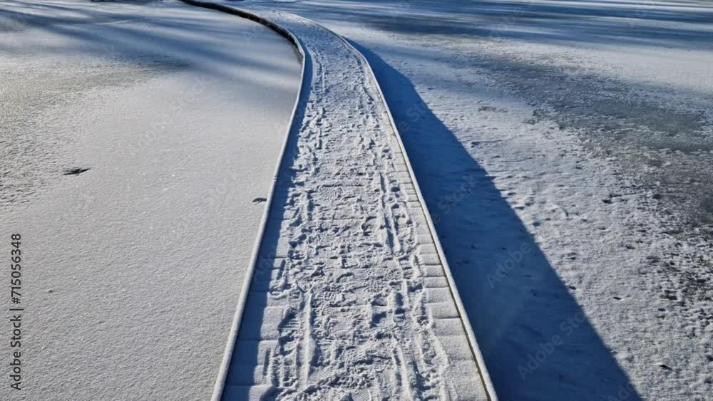 floating walkway made of wooden planks. narrow curved paths on stakes ...