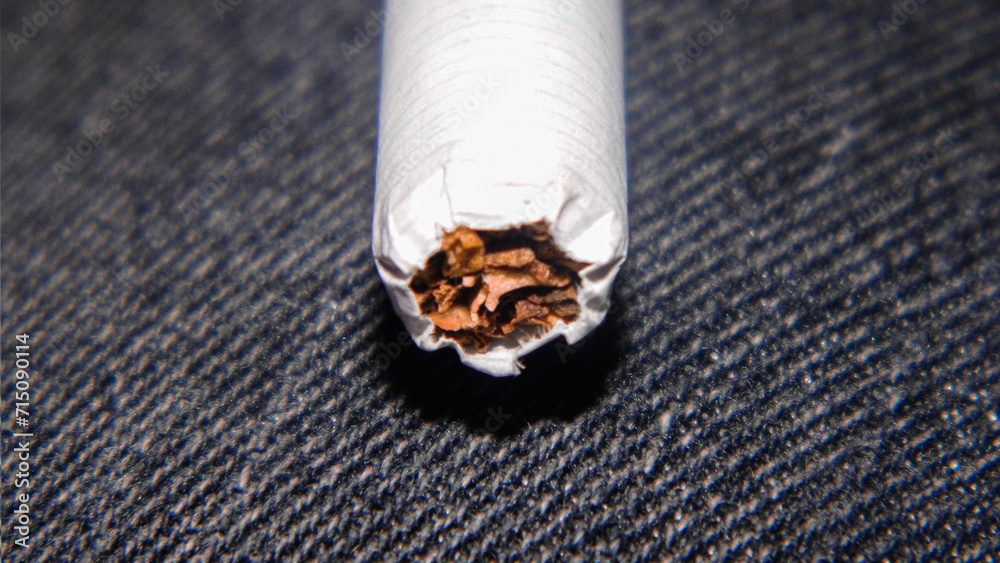 Cigarrete tobacco tip in a texture Stock Photo | Adobe Stock